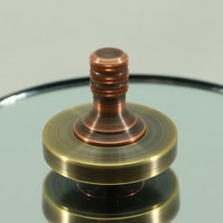 Precision metal spinning top in antique brass and copper – Kemner Design